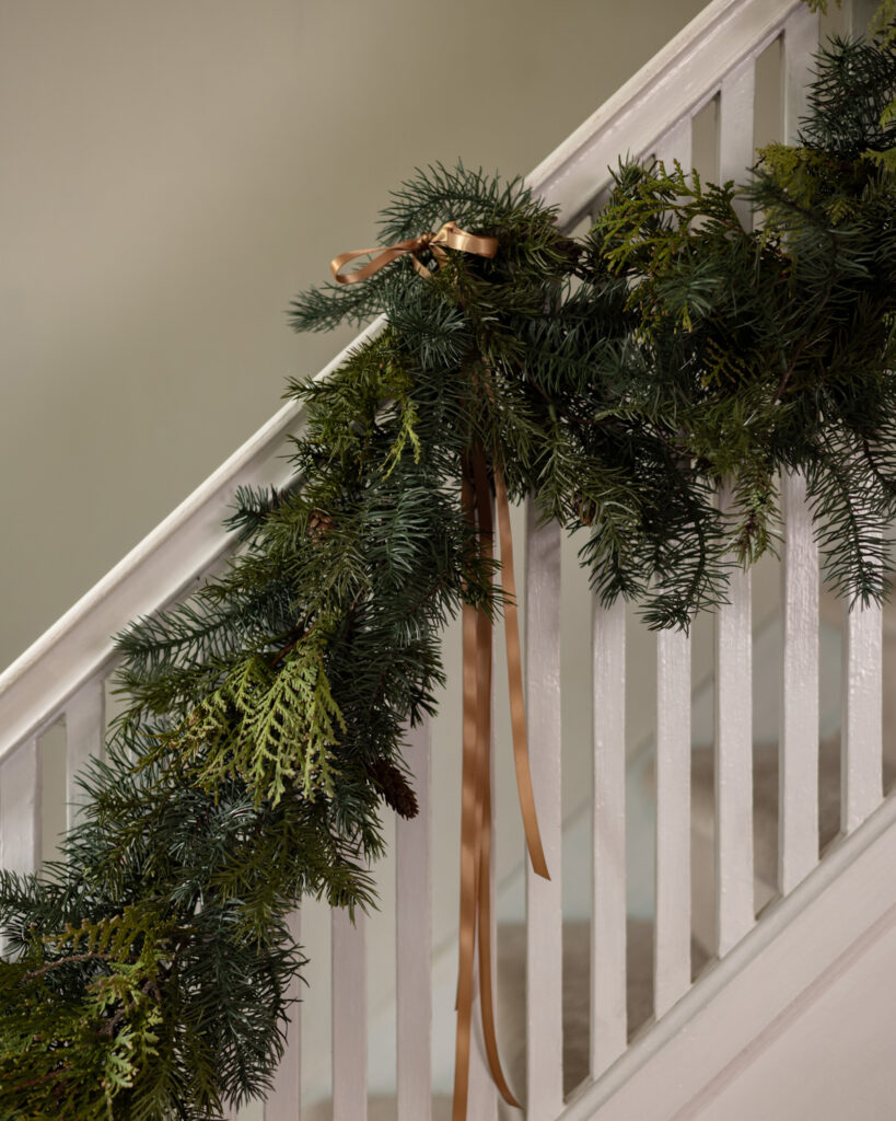 How to Hang Garland on Stair Railings - The Creek Line House