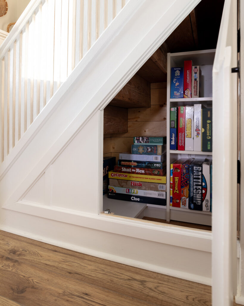 Under the Stairs Storage for Board Games and Puzzles - The Creek Line House